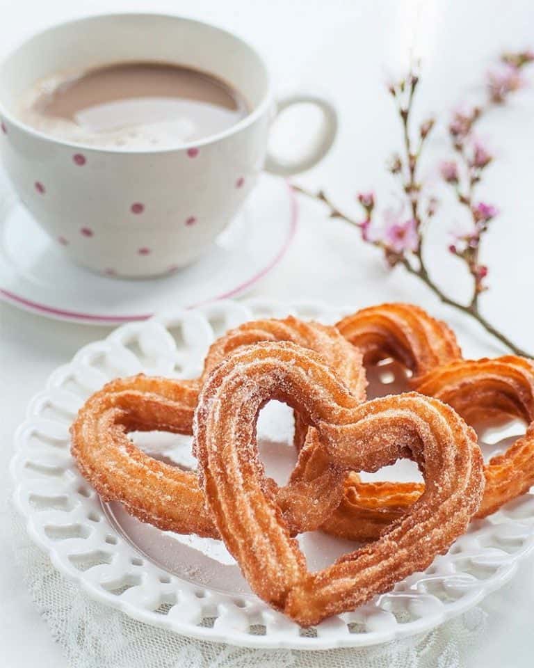 Heart-shaped churros with chocolate sauce